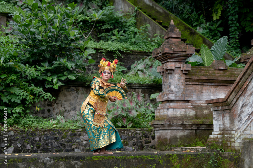 Balinese dancer woman in gold costume, Temple Bali Indonesia Stock ...