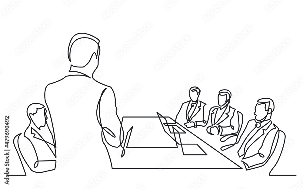 team member speaking at board meeting before business executives ...