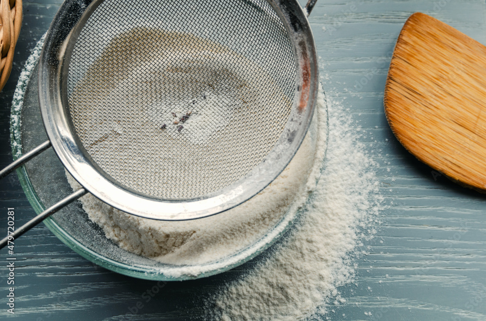 Flour beetles, parasites in wholemeal flour through a metal sieve Stock ...