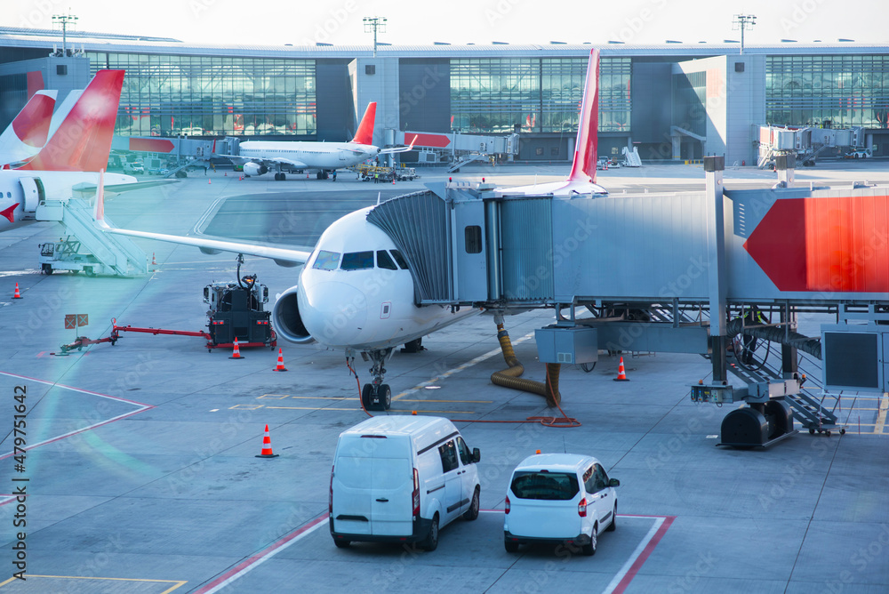 Airport with many airplanes. Airplanes at the terminal gate ready for ...
