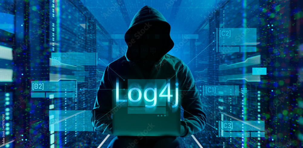 cybersecurity vulnerability Log4J and hacker,coding,malware concept.Hooded computer hacker in ...
