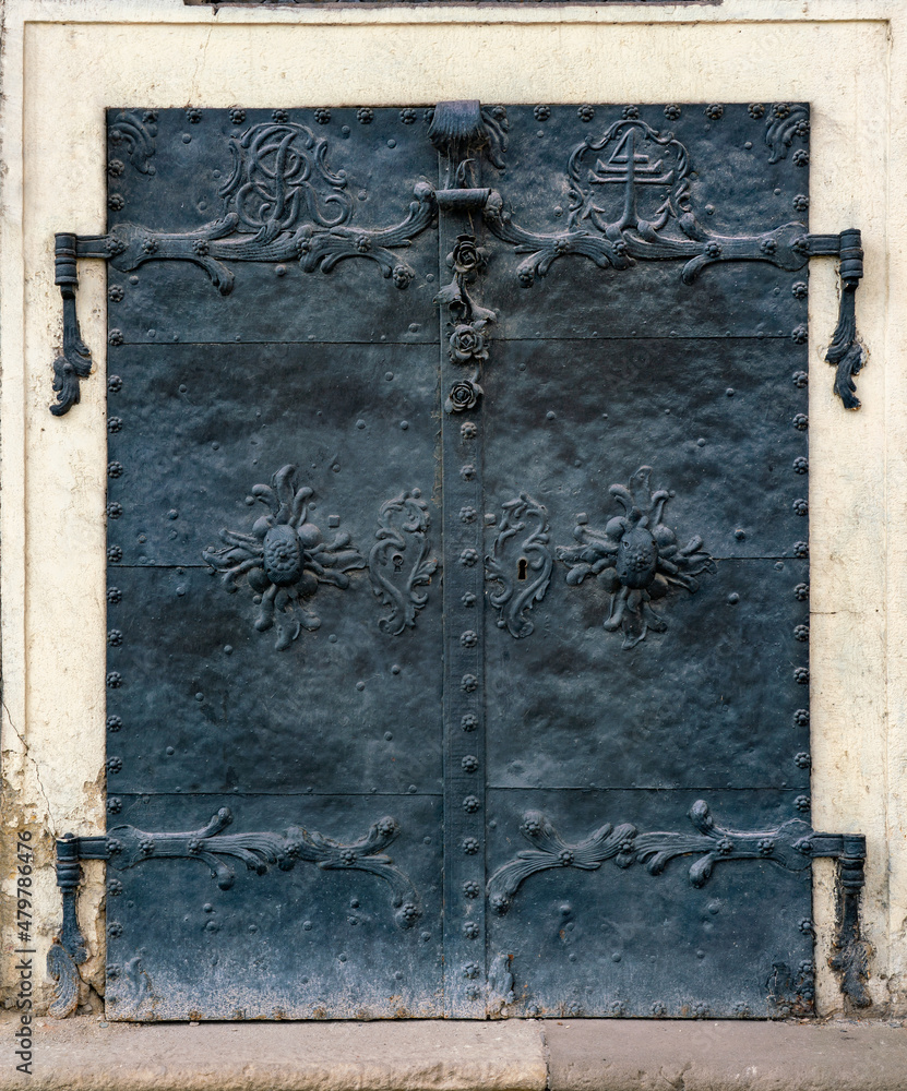 Old iron door with alchemical symbols in black metallic texture ...