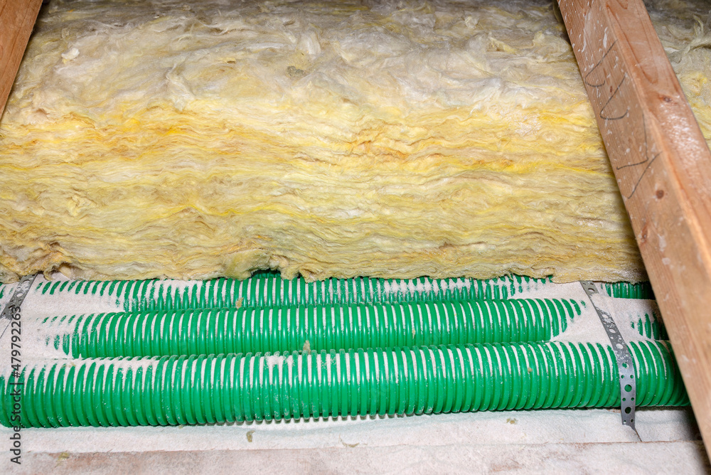 Expanded perlite and mineral wool insulation laid on pipes in domestic ...