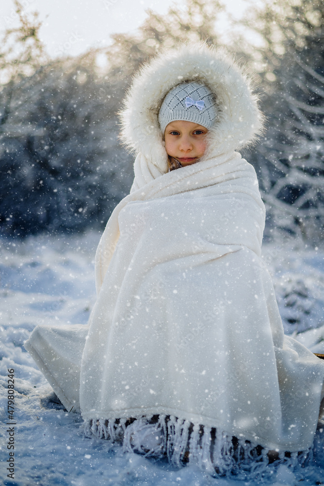 adorable little girl having fun in beautiful magic winter park during ...