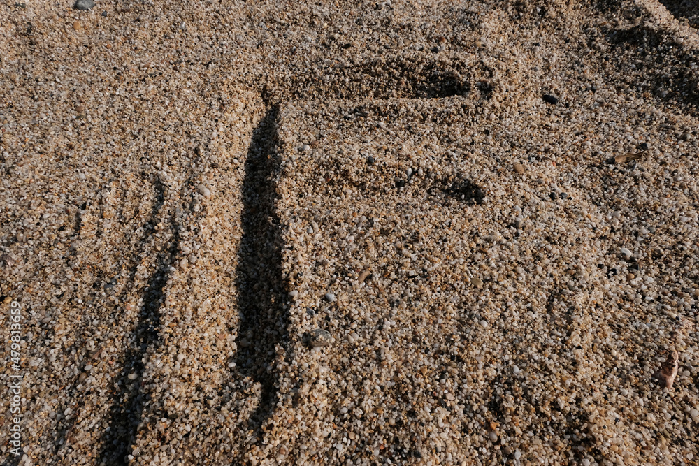 English alphabet. Sand on the beach. The letter F Stock Photo | Adobe Stock