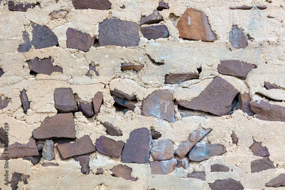Photograph of an old and deteriorating wall with grey concrete and ...