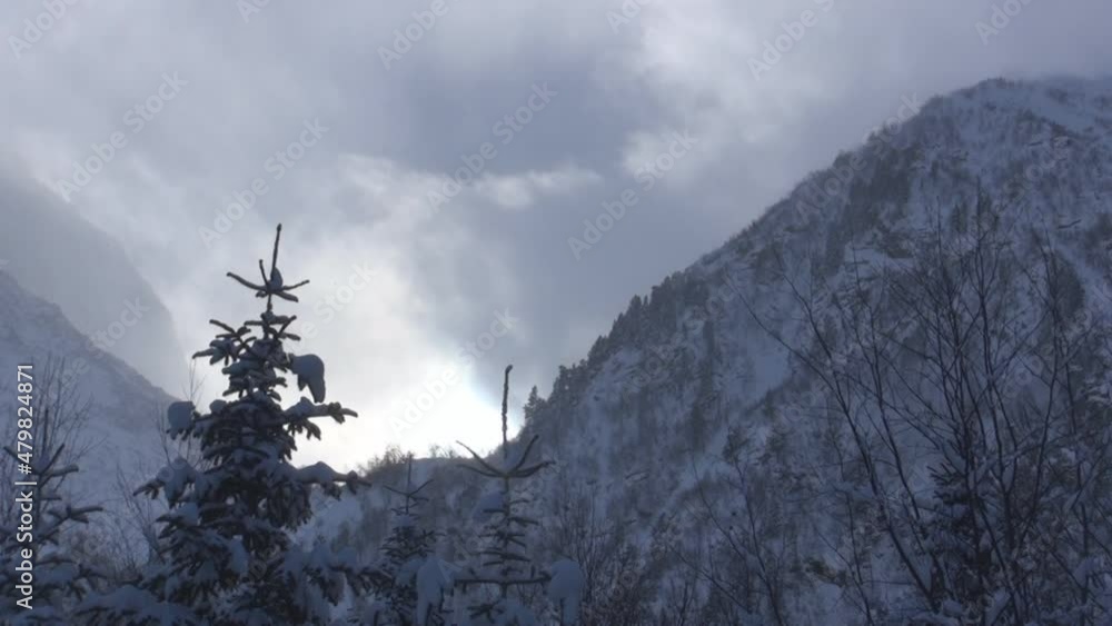 Cold windy weather in the mountains, wind over the mountain peaks ...