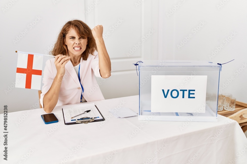 Beautiful caucasian woman at political campaign election holding ...