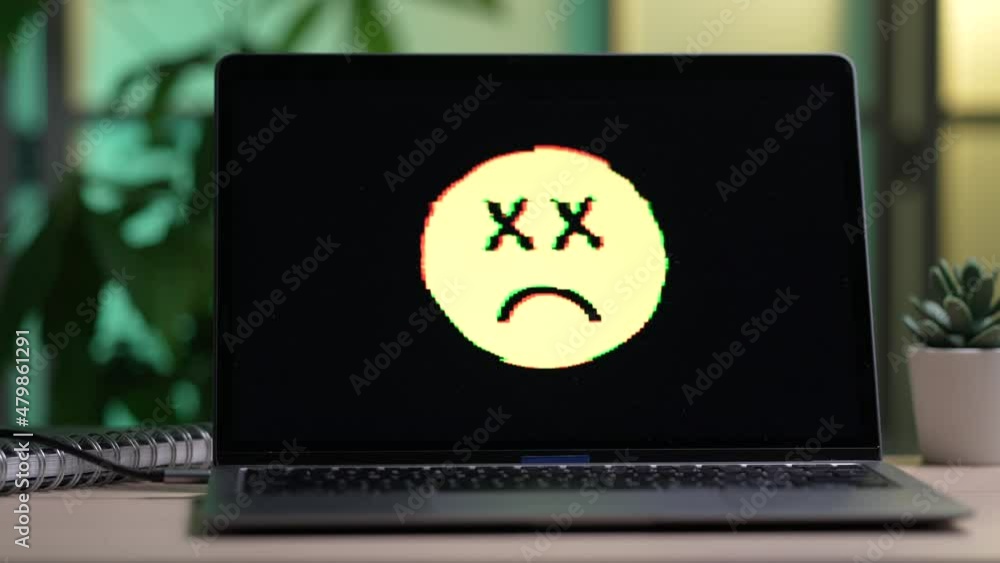 Laptop Computer Screen With a Sad Face Emoji on Display Stock Video ...
