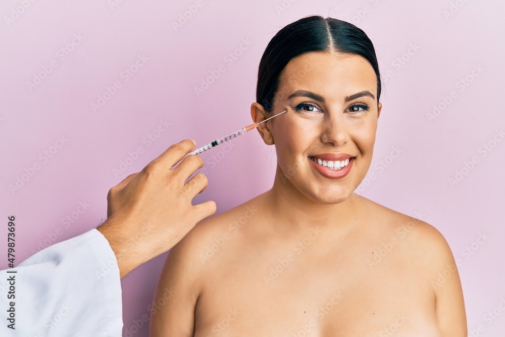 Beautiful brunette woman having botox injection, anti aging lifting ...