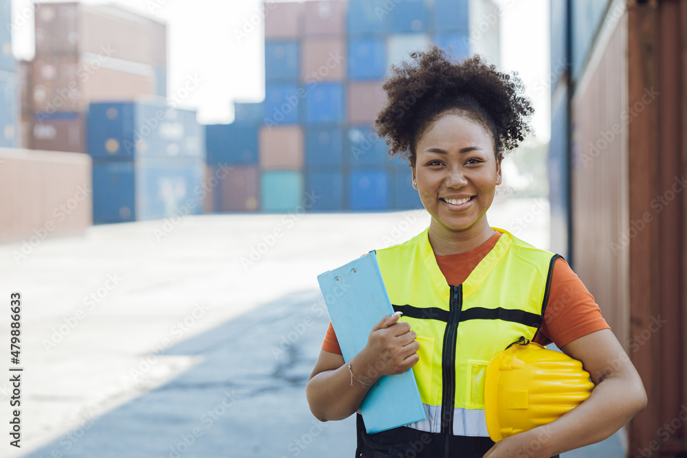 happy African women worker in port cargo shipping industry standing ...