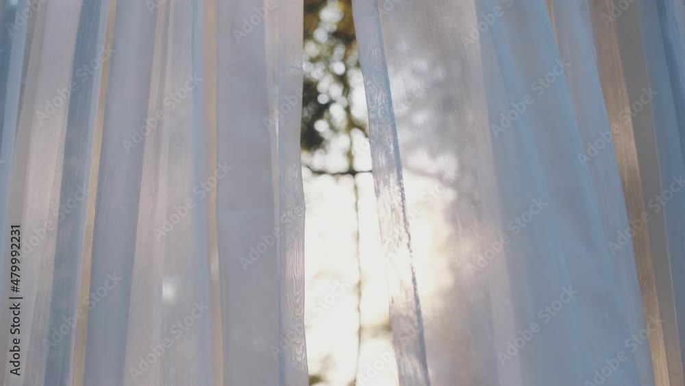close-up of white transparent curtain fabric in wind blowing with ...