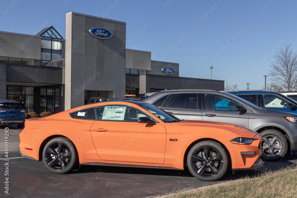 Ford Mustang display at a dealership. Ford offers the Mustang in a base ...