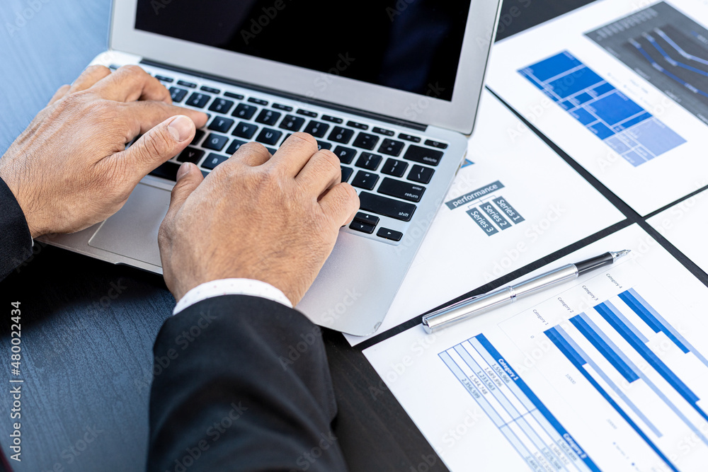 Close-up A businessman working in a private room, He is typing on a ...