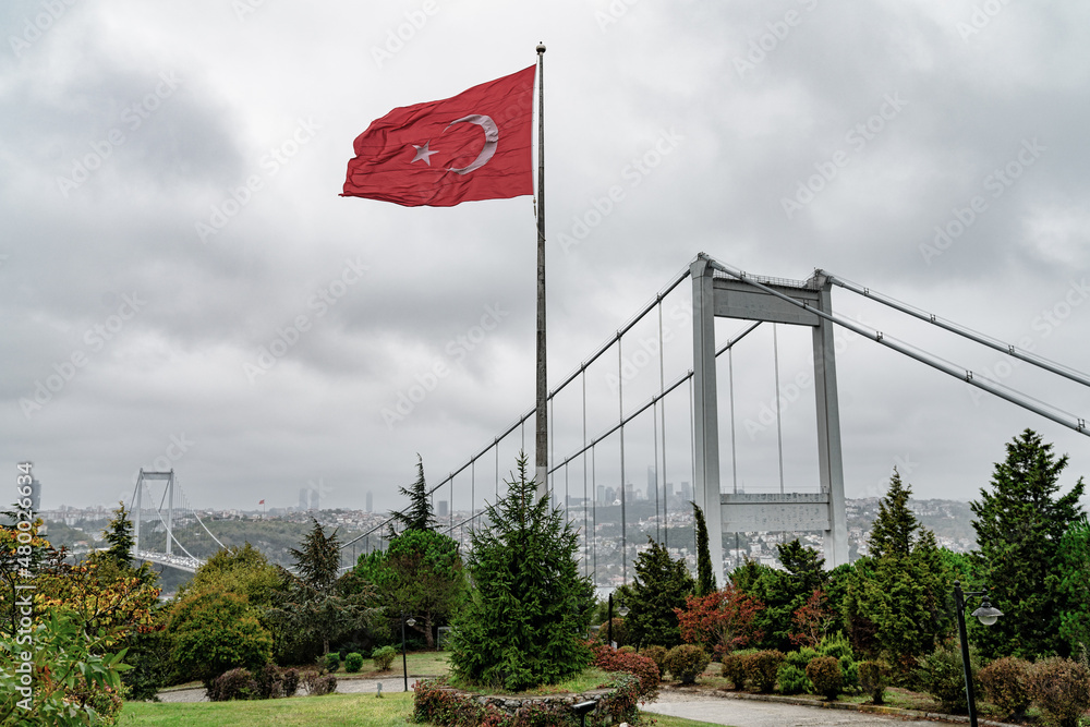Turkish flag by Fatih Sultan Mehmet Bridge, spanning the Bosphorus ...
