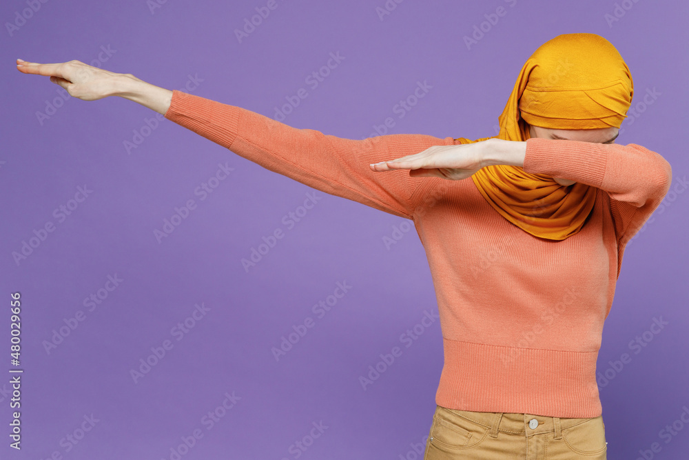 Young arabian asian muslim woman in abaya hijab yellow clothes doing ...