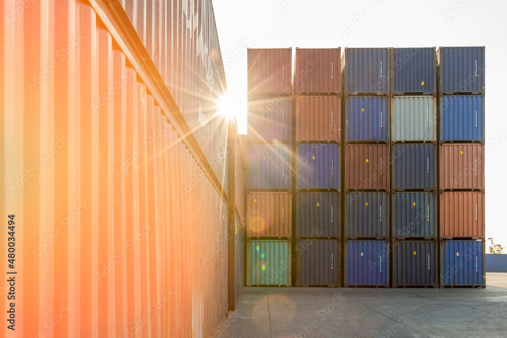 Stack of containers in a harbor. Shipping containers stacked on cargo ...
