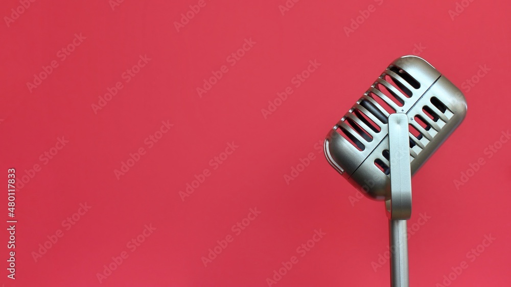 Vintage and retro concept. Vintage classic microphone on red background ...