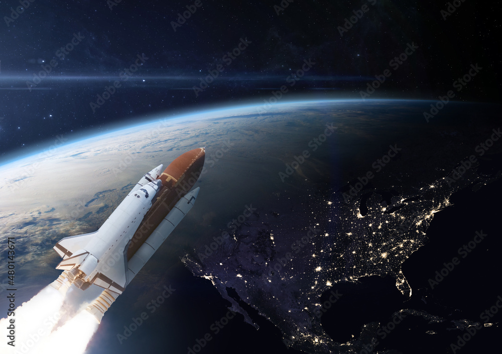 Space shuttle orbiting Earth planet. Elements of this image furnished ...