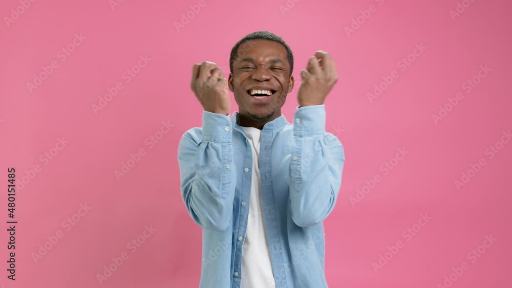 Emotional black African American man in denim shirt and white T-shirt ...
