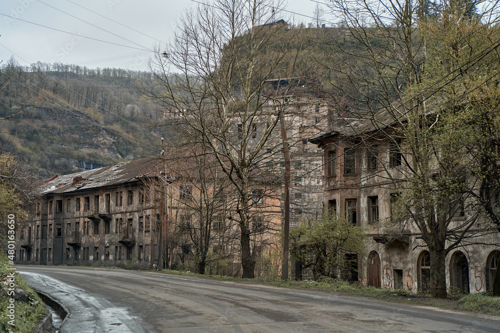 Abandoned crumbling buildings in a residential city. A dying city ...