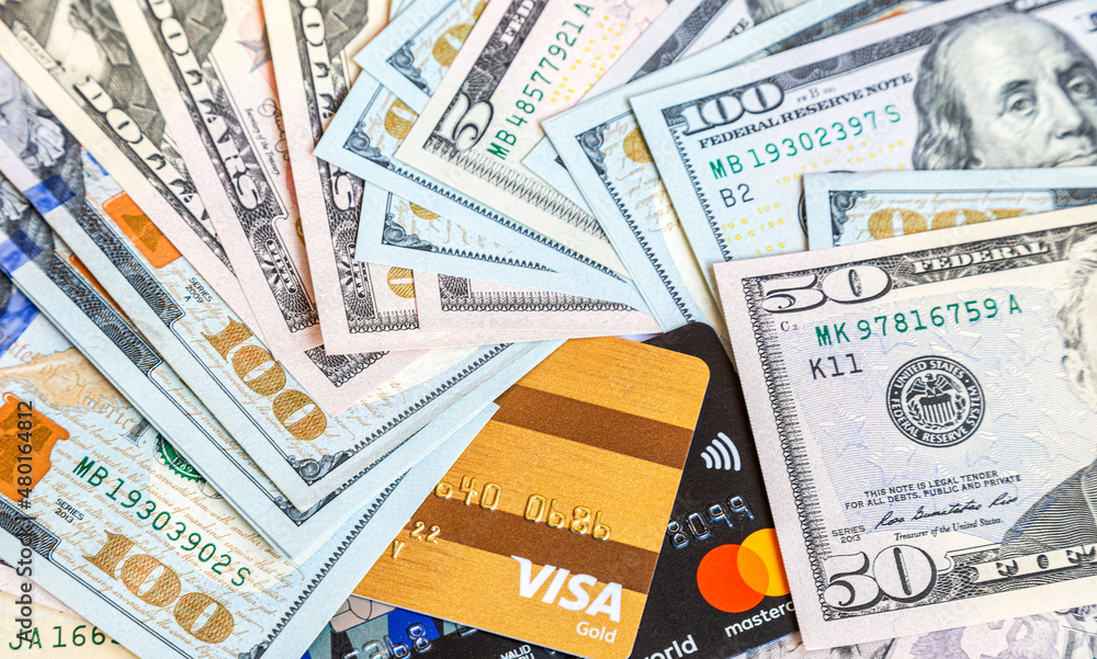 MasterCard and Visa with american dollars banknotes Stock Photo | Adobe ...