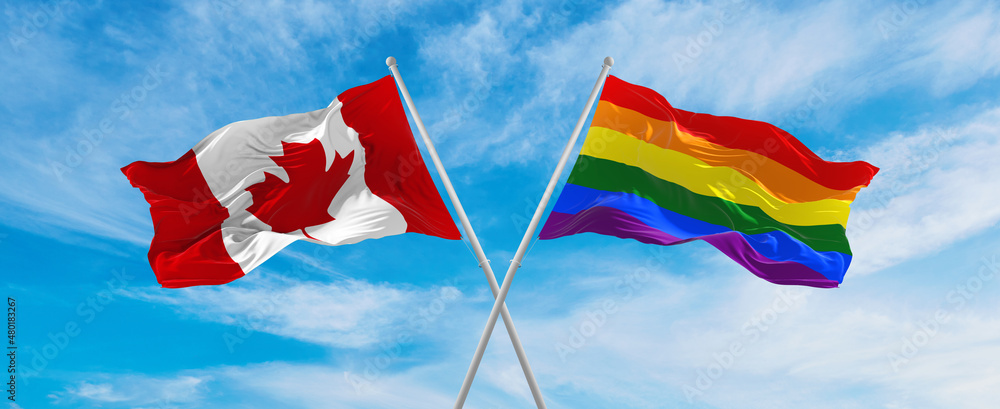 Foto de crossed national flags of Canada and LGBT Pride flag waving in ...