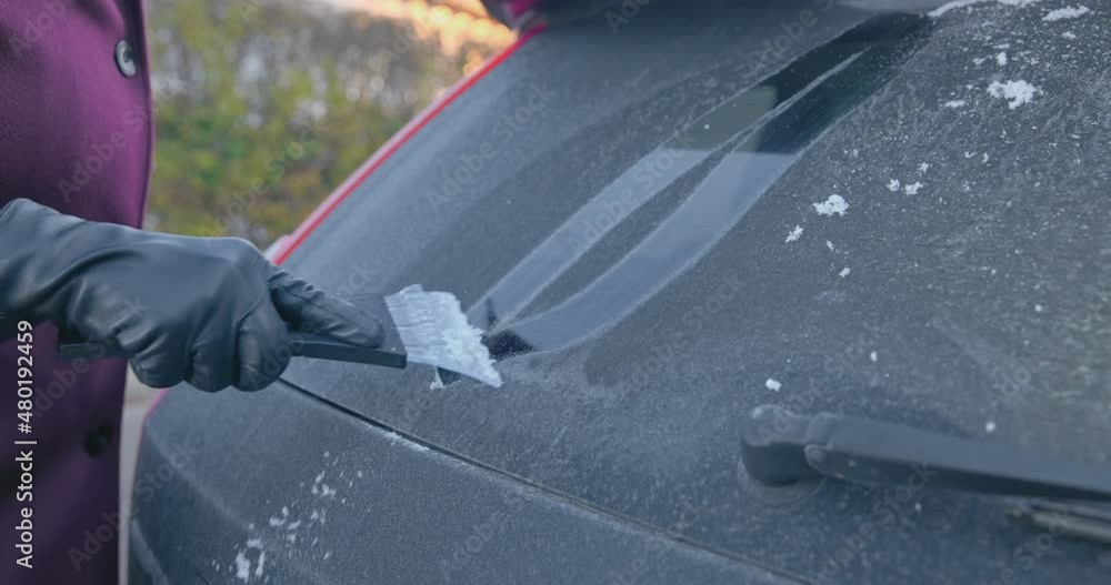 Winter Driving - Scraping ice off the frozen rear window of a car ...