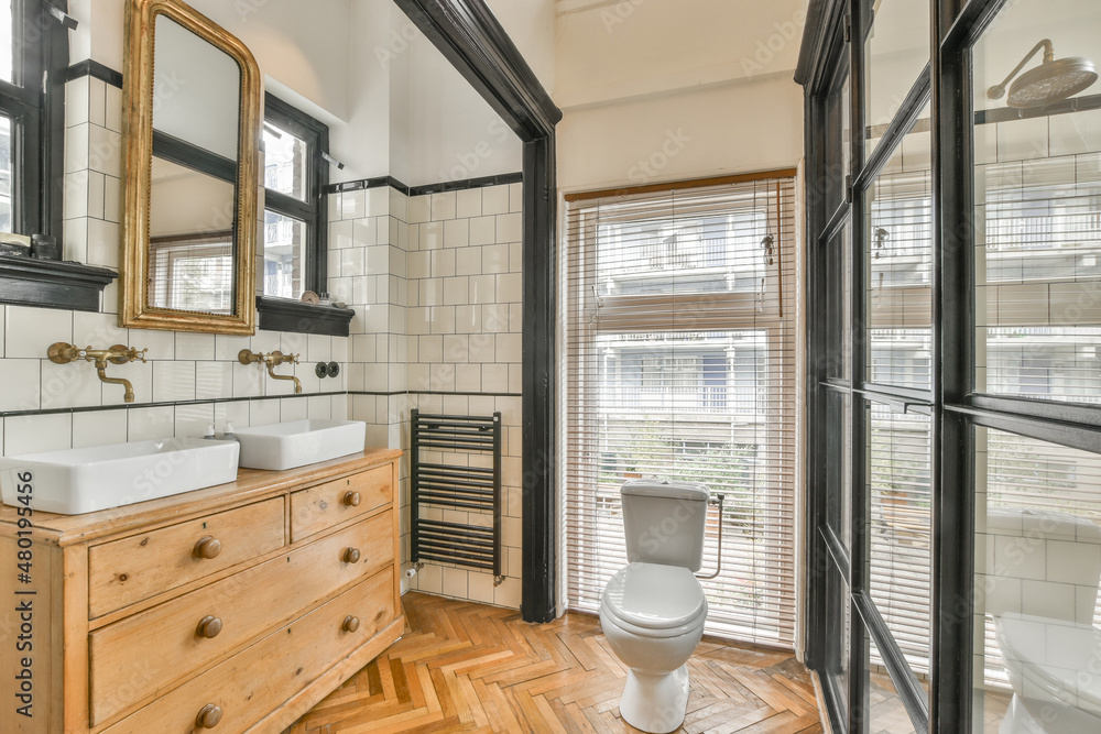 Interior of lavatory room with sink and cabinets and toilet Stock Photo ...