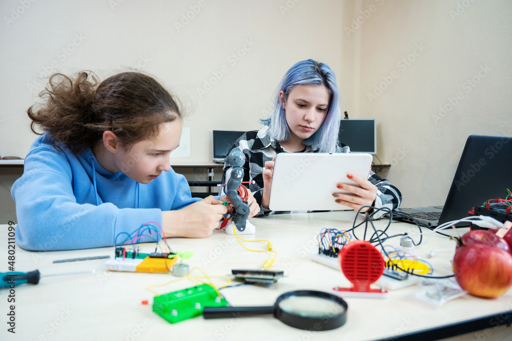 Teenage group at robotics school makes and programs robot from the ...