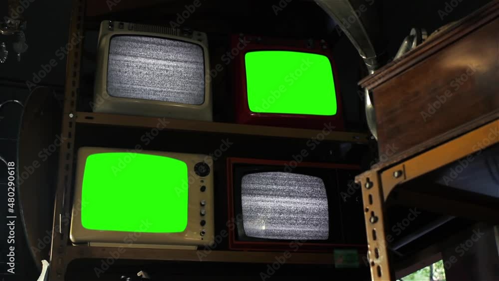 Stockvideo Four Retro Televisions Turning On Green Screen and Static ...