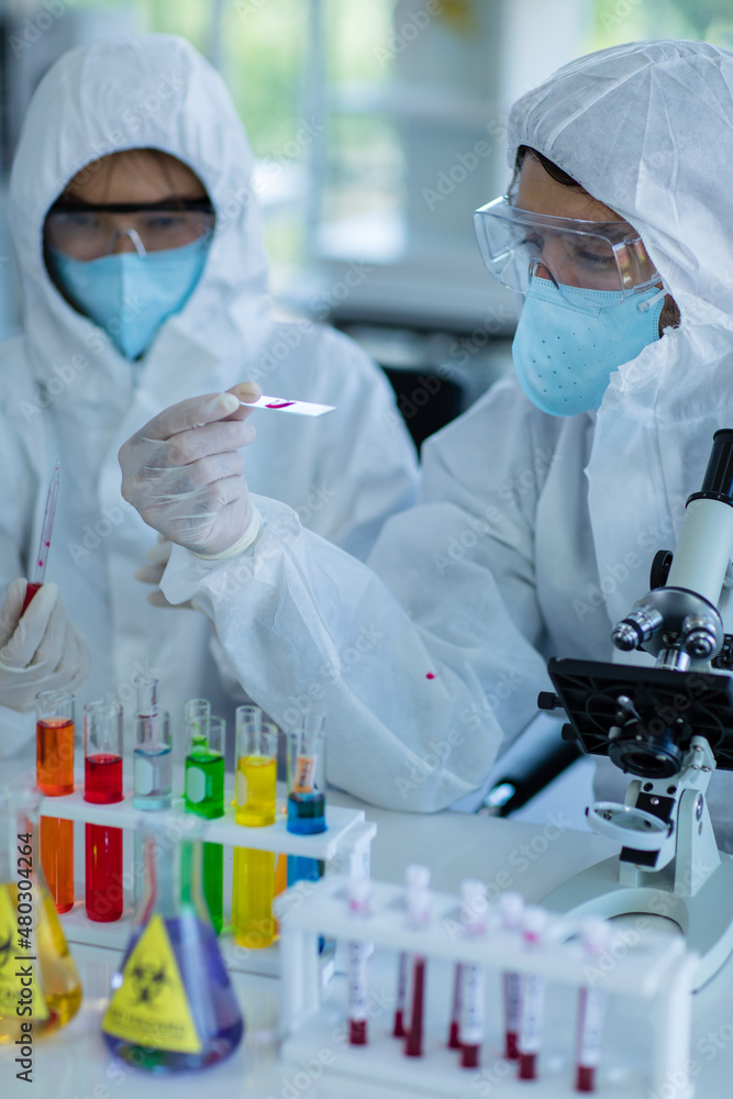 Asian male female professional scientists colleague in ppe full ...