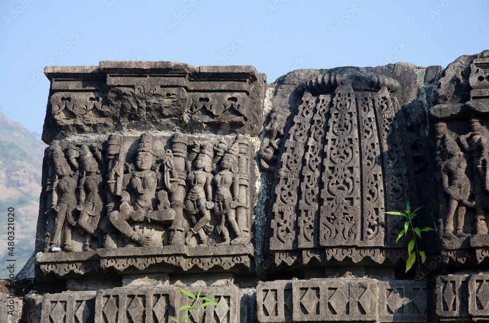 Carved idol on the outer wall of Kukdeshwar Temple, dedicated to Lord ...