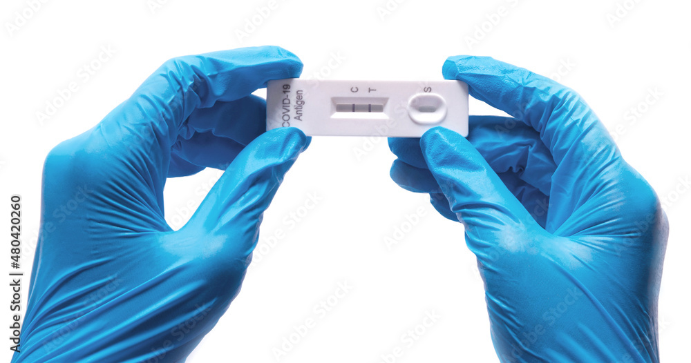 Doctor holding a COVID-19 test kit Test results are negative, not ...