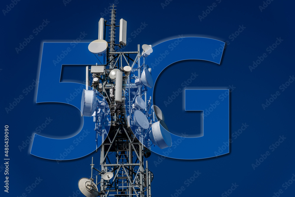 5G logo on metal tower blue background with telecommunication antennas ...