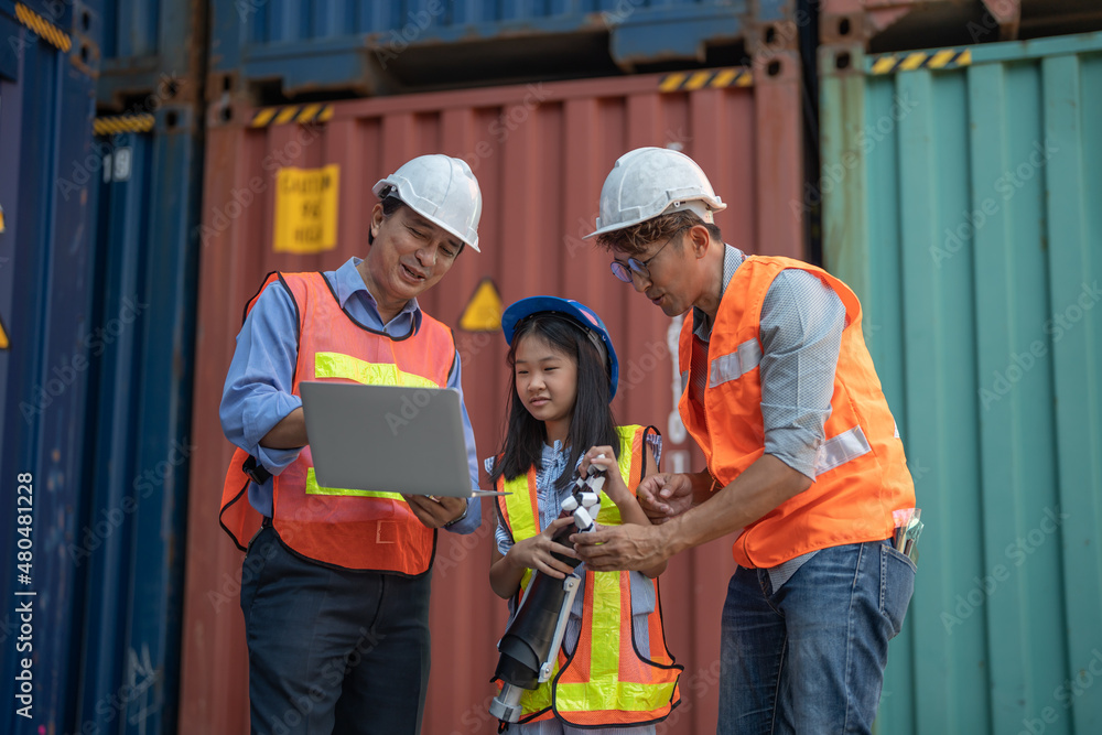 Engineer Teachers teaching a girl about robot hand In Science Robotics ...