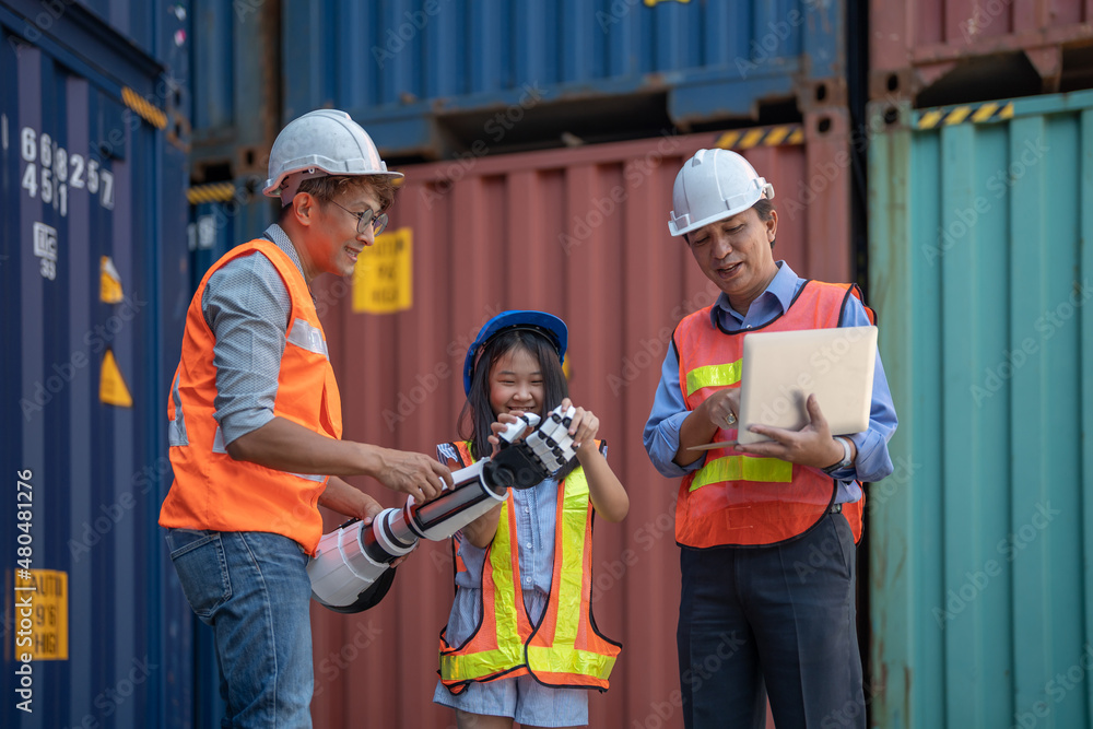Engineer Teachers teaching a girl about robot hand In Science Robotics ...