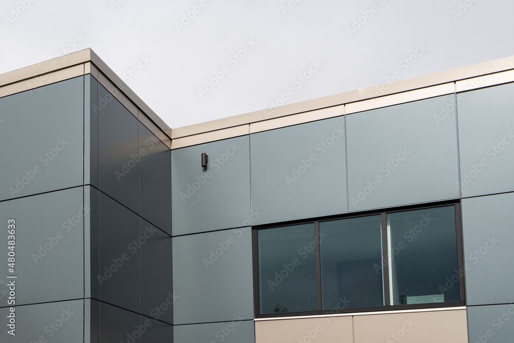 The exterior wall of a contemporary commercial style building with ...
