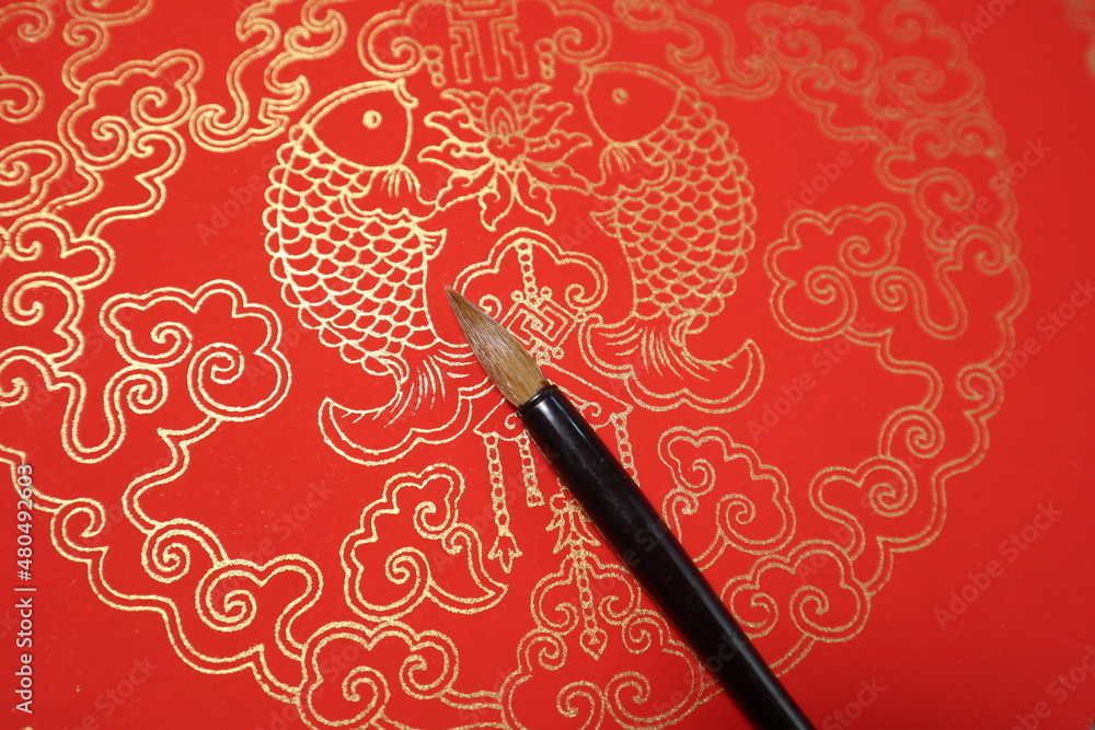 red and golden spring couplet paper with chinese writing brush design ...