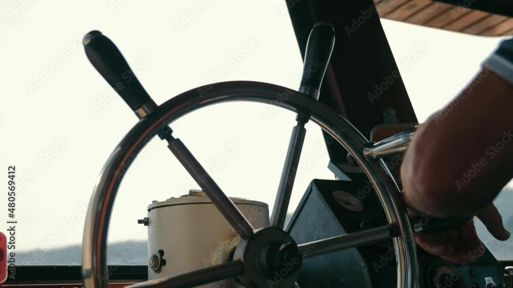 A small rudder of a small transport ship. The captain of the ship turns ...
