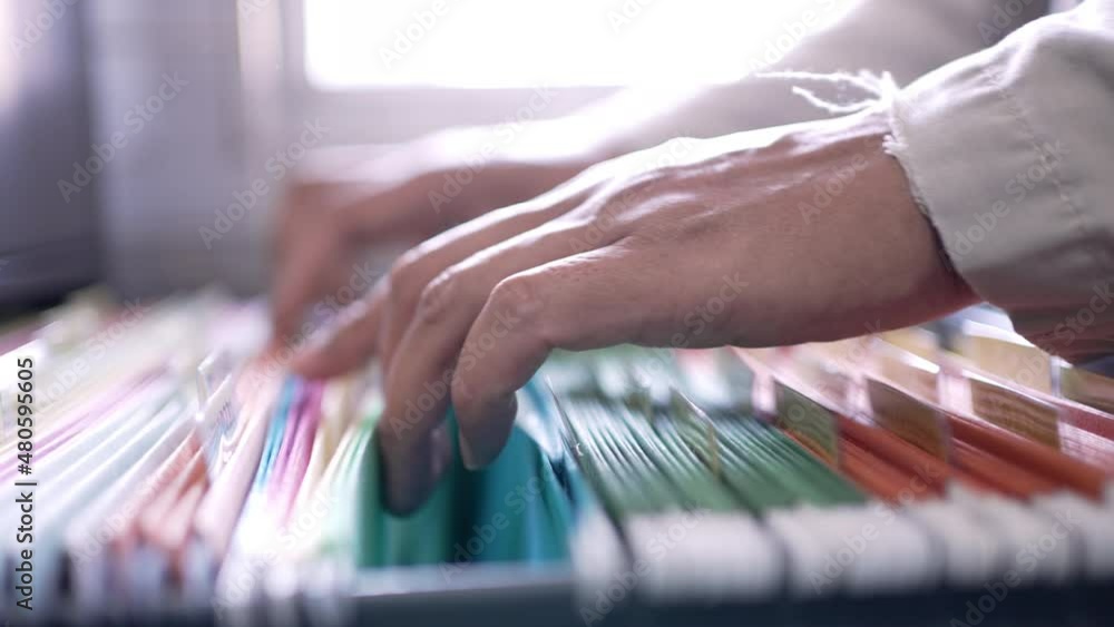 Business man Find documents in the filing cabinet Stock Video | Adobe Stock