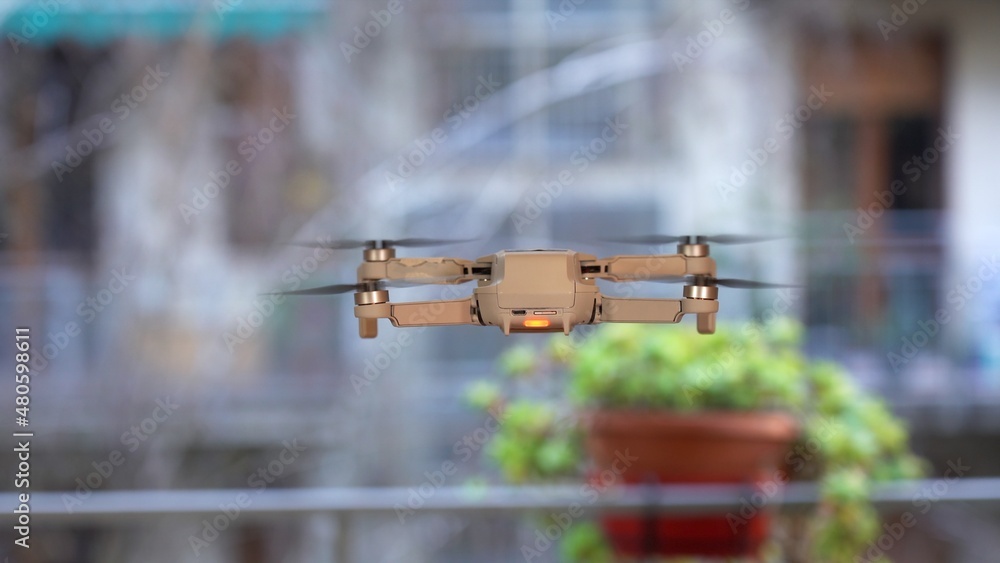 Small light drone on the balcony illegally captures the window and the ...