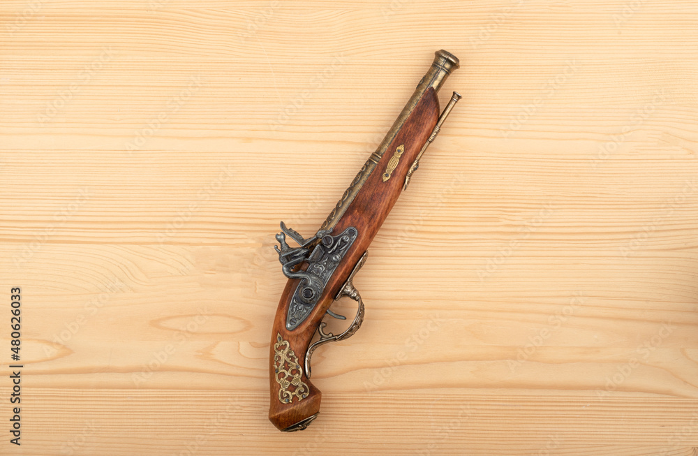 Antique single-shot muzzle-loading pistol with a percussion lock on a ...