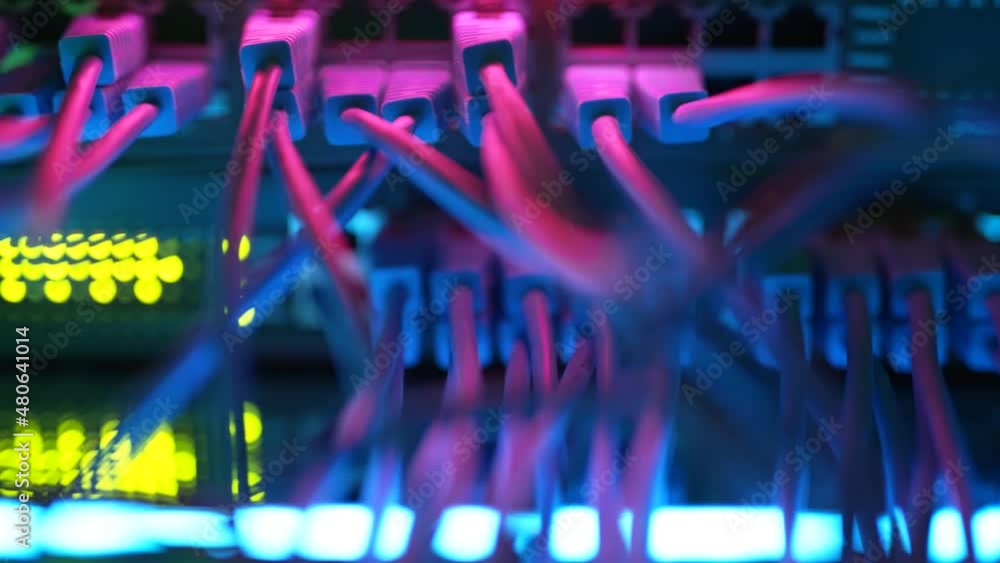 Close up fiber optic in server room. Network cables installed in the ...