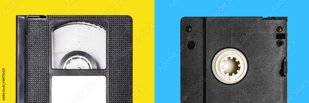 Black vhs tape isolated on blue. Outdated technology background. Empty ...