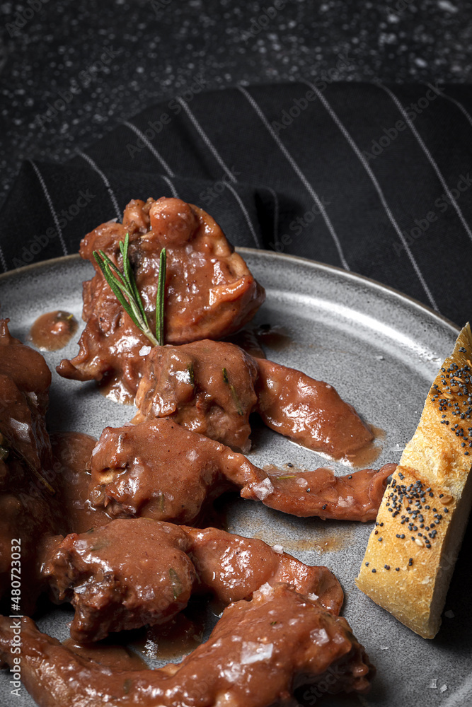 Traditional rabbit meat stew with red wine sauce Stock Photo | Adobe Stock
