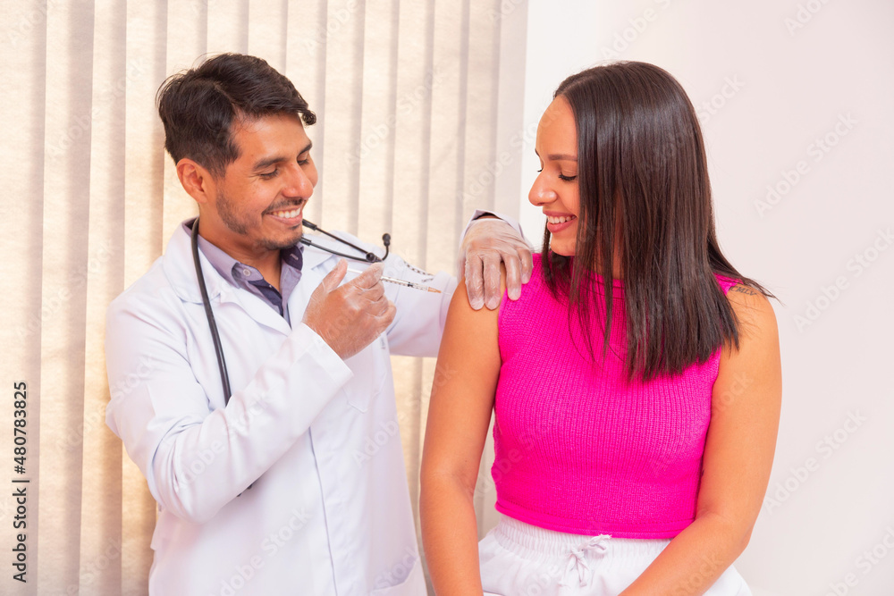 Doctor applying the vaccine against covid 19 and the new variant ...