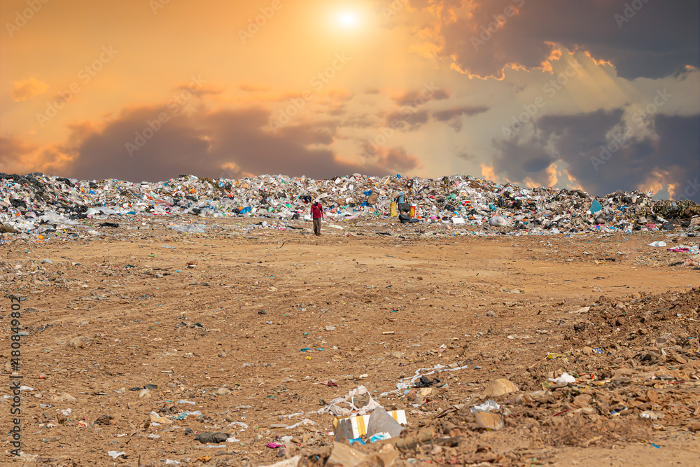 poor person collect garbage for sale because of poverty, garbage dump ...