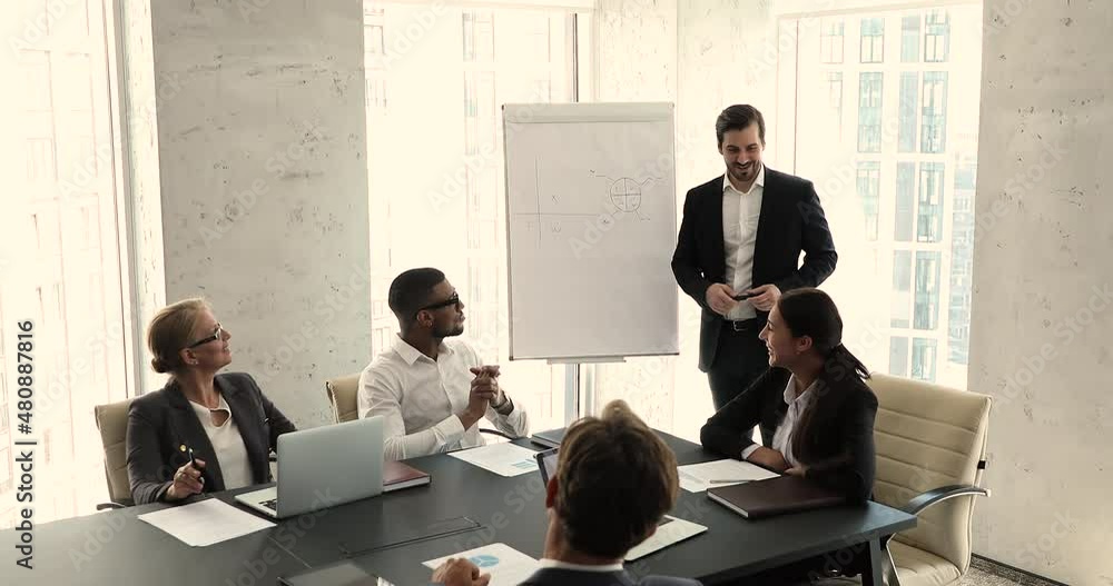 Boss holds briefing with multi racial company employees, presenter ...