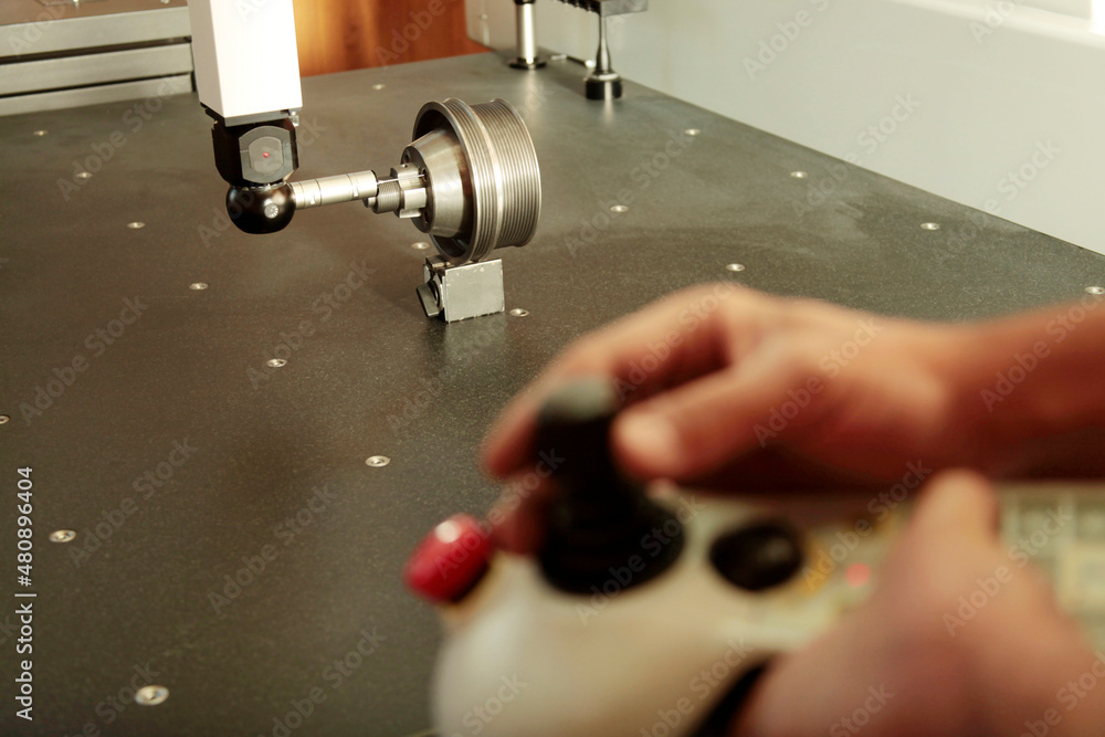 CMM probe measuring on steel cylinder. CMM probe Machine control ...